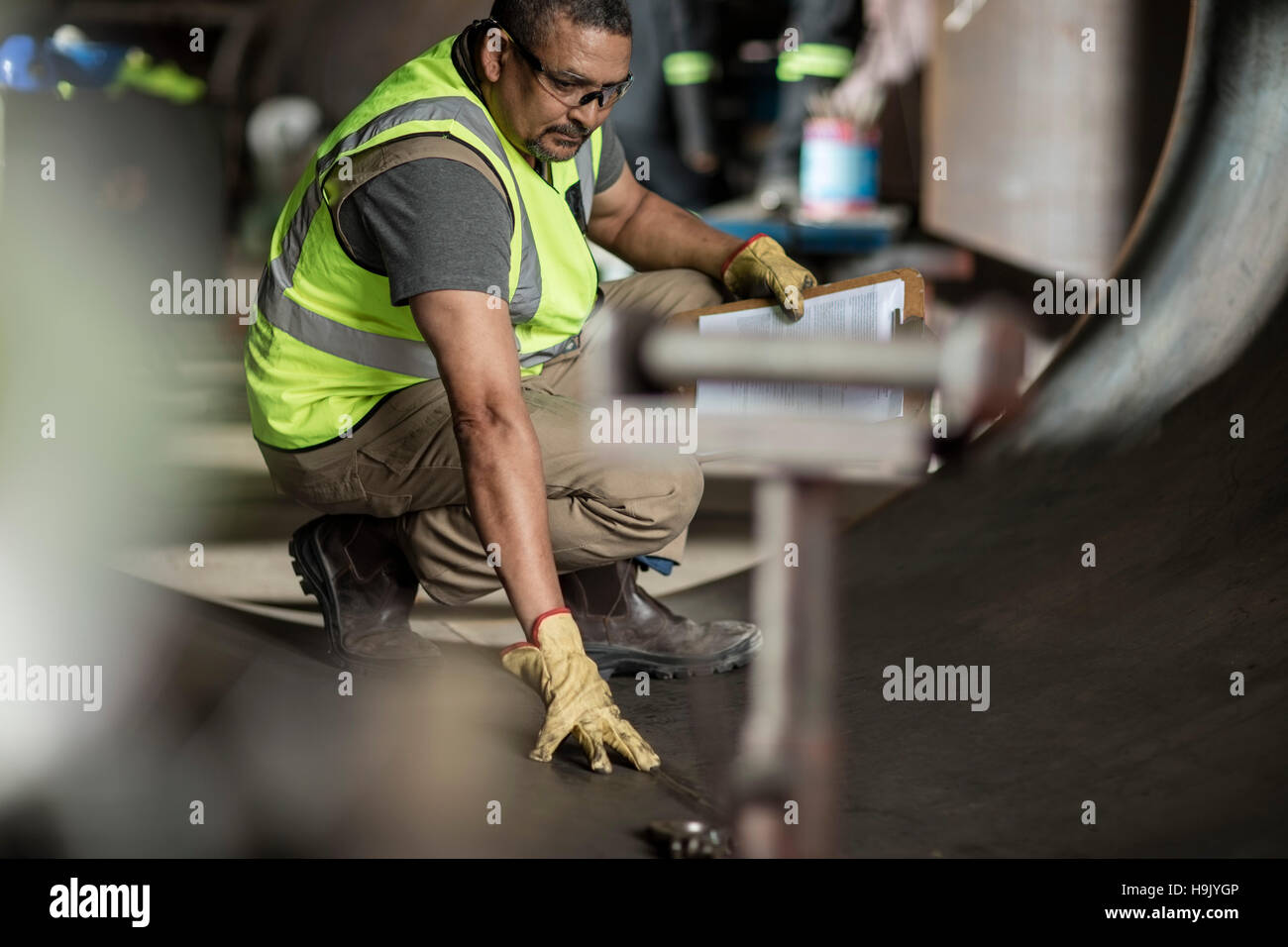 Engineer examining construction parts Stock Photo - Alamy