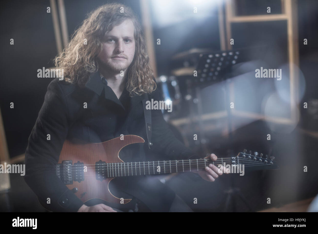 Portrait of guitarist at recording studio Stock Photo - Alamy