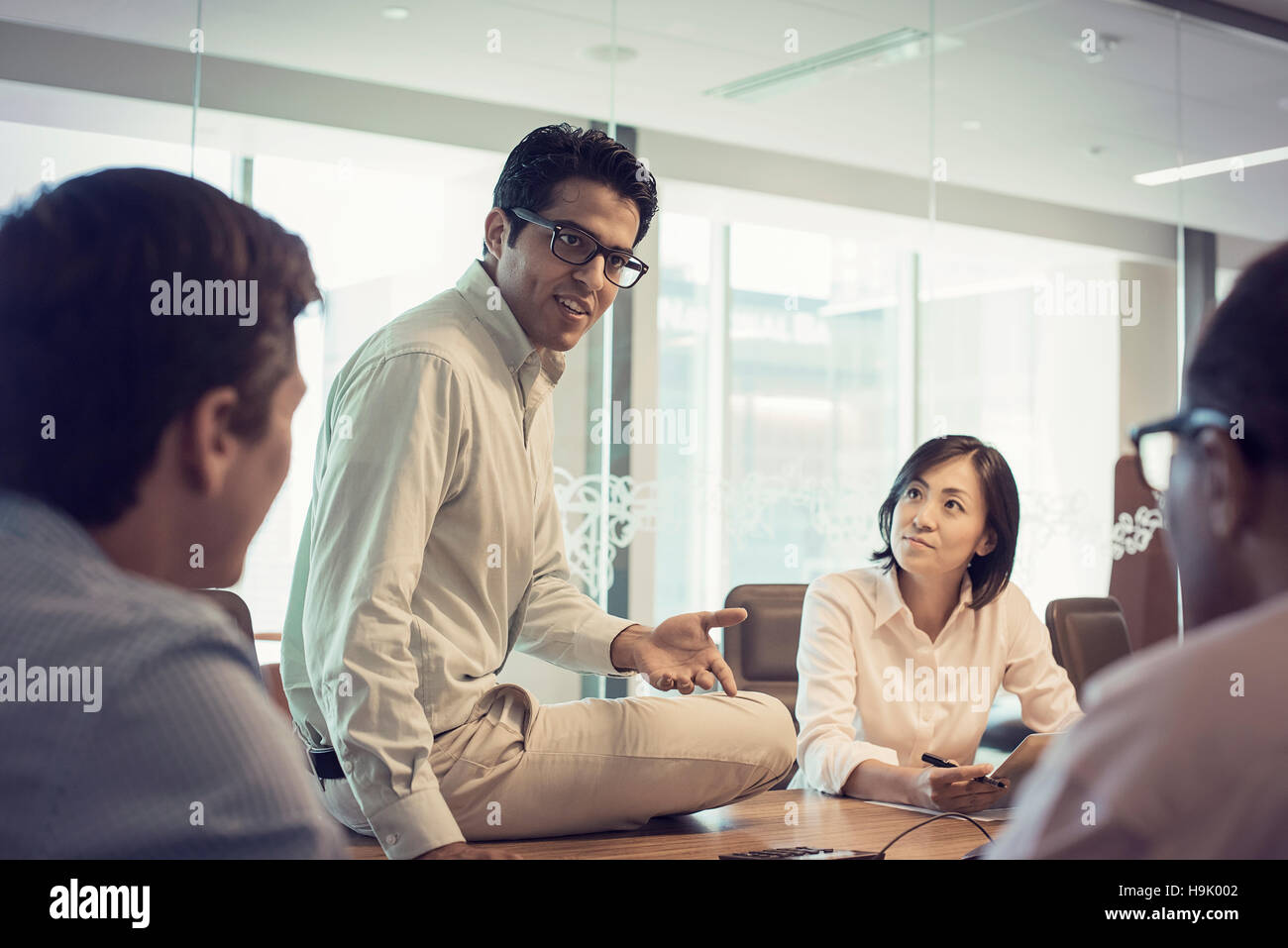 Business people in meeting having interesting discussion Stock Photo ...