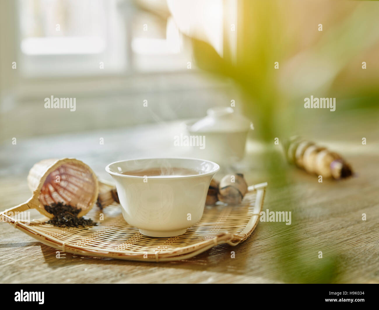 Bowl of steaming tea Stock Photo - Alamy
