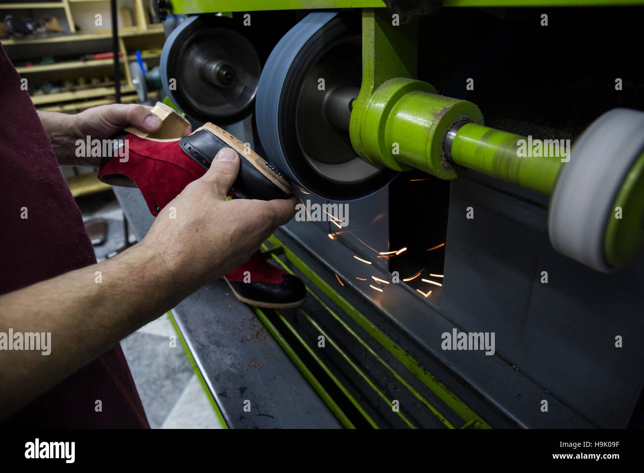 Shoemaker using a machine in his workshop Stock Photo - Alamy