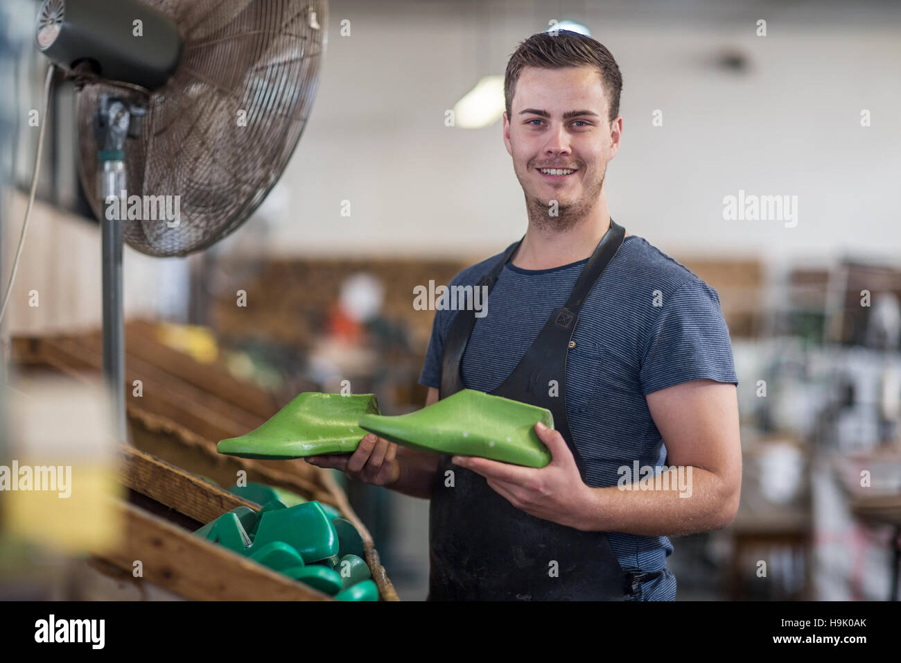 Portrait of smiling shoemaker in workshop Stock Photo - Alamy