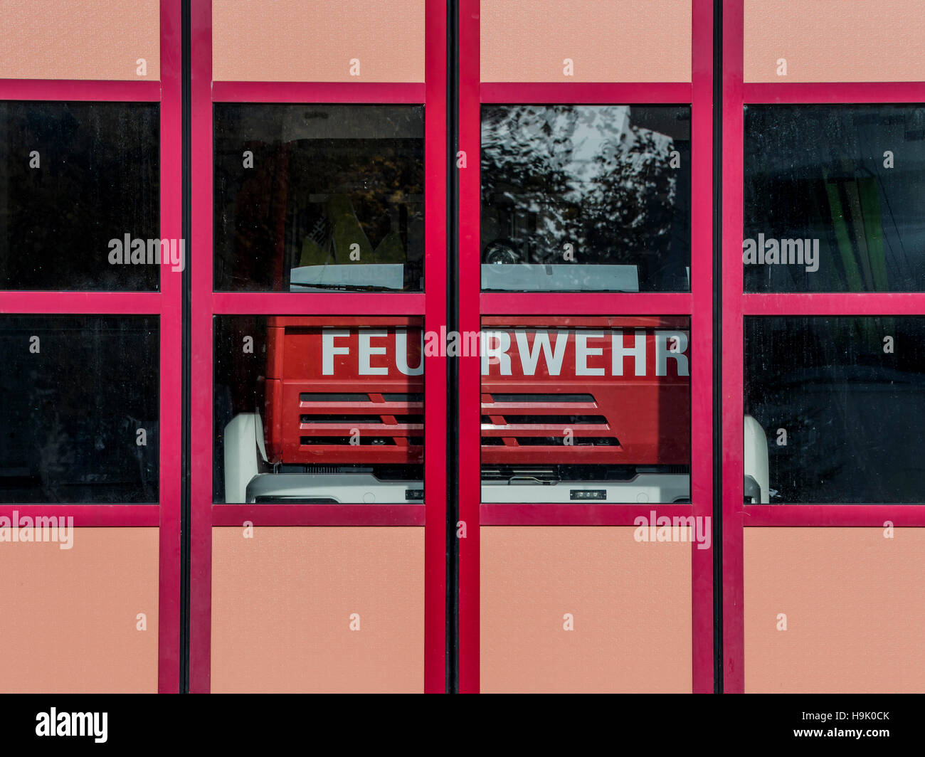 Fire engine behind closed doors of fire station Stock Photo - Alamy