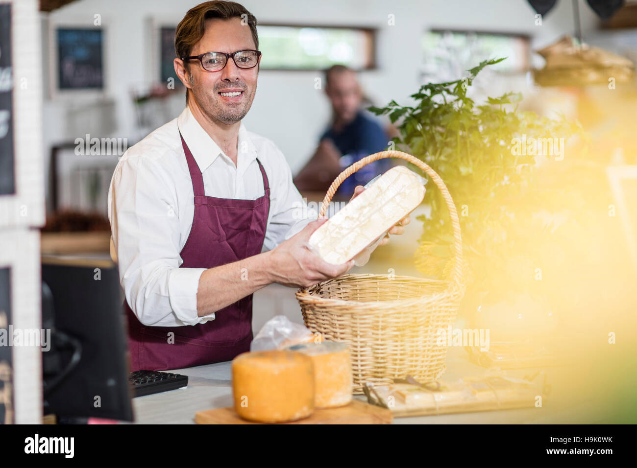 Portrait of grocer in a farm shop Stock Photo - Alamy