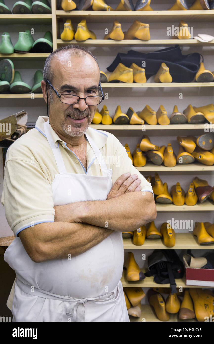 Portrait of a confident shoemaker in his workshop Stock Photo - Alamy