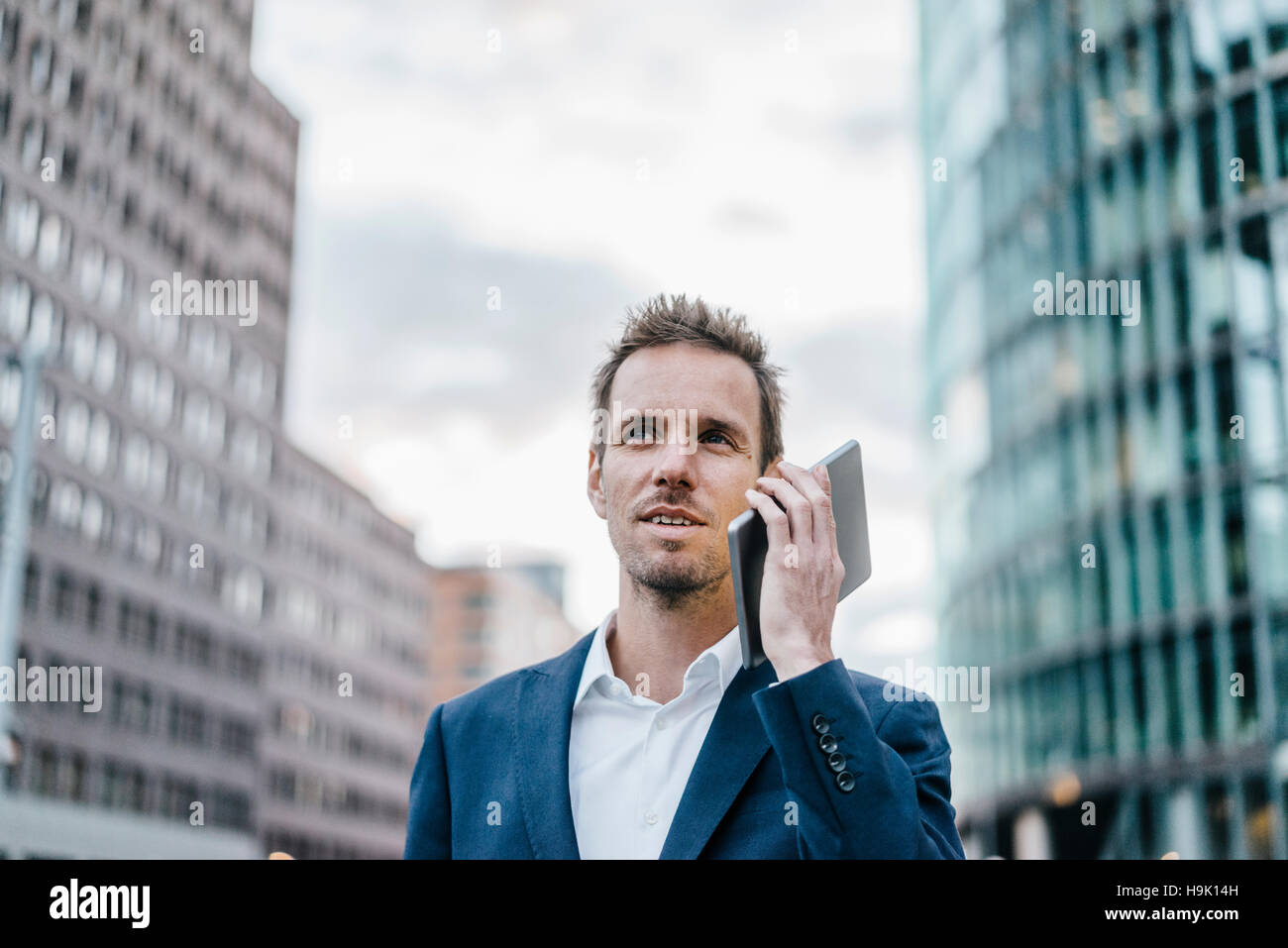 Germany, Berlin, portrait of businessman with tablet Stock Photo - Alamy