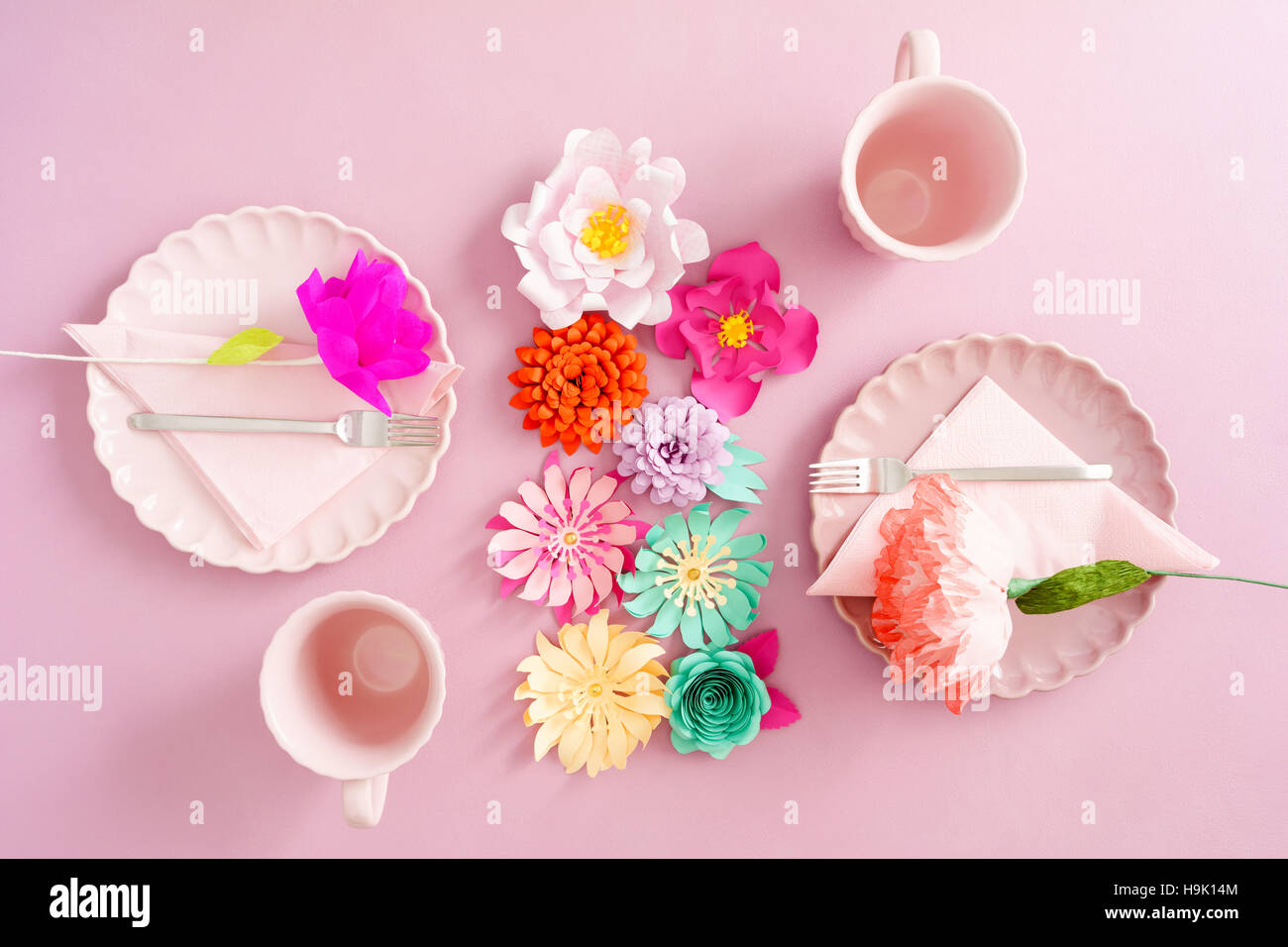 Table with paper flowers Stock Photo - Alamy