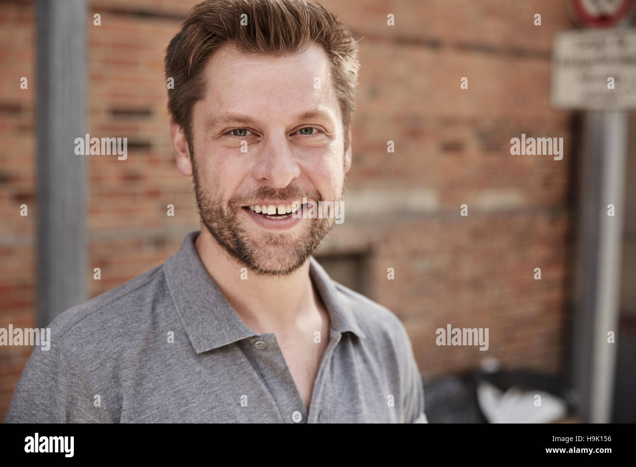 Portrait of smiling man outdoors Stock Photo - Alamy