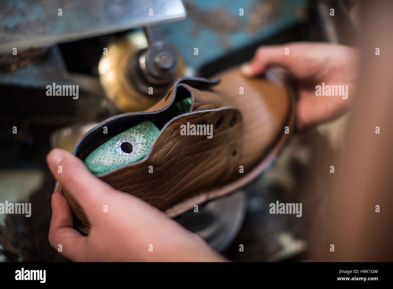 Shoemaker working on shoe in workshop Stock Photo - Alamy