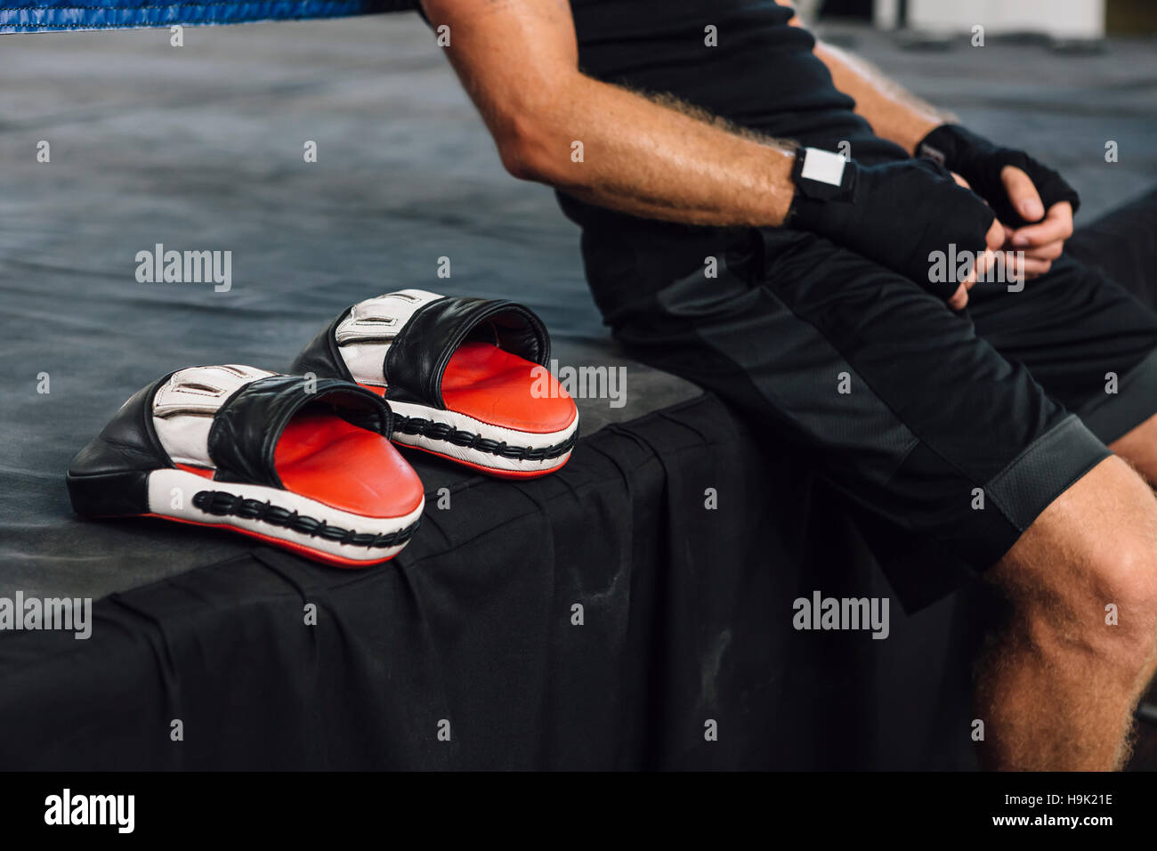 Boxer sitting at boxing ring Stock Photo - Alamy