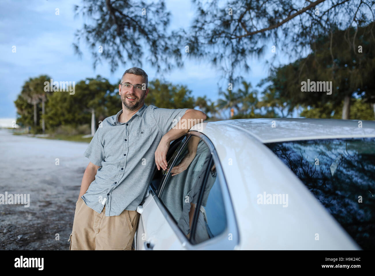 Man on a road trip taking a rest Stock Photo - Alamy
