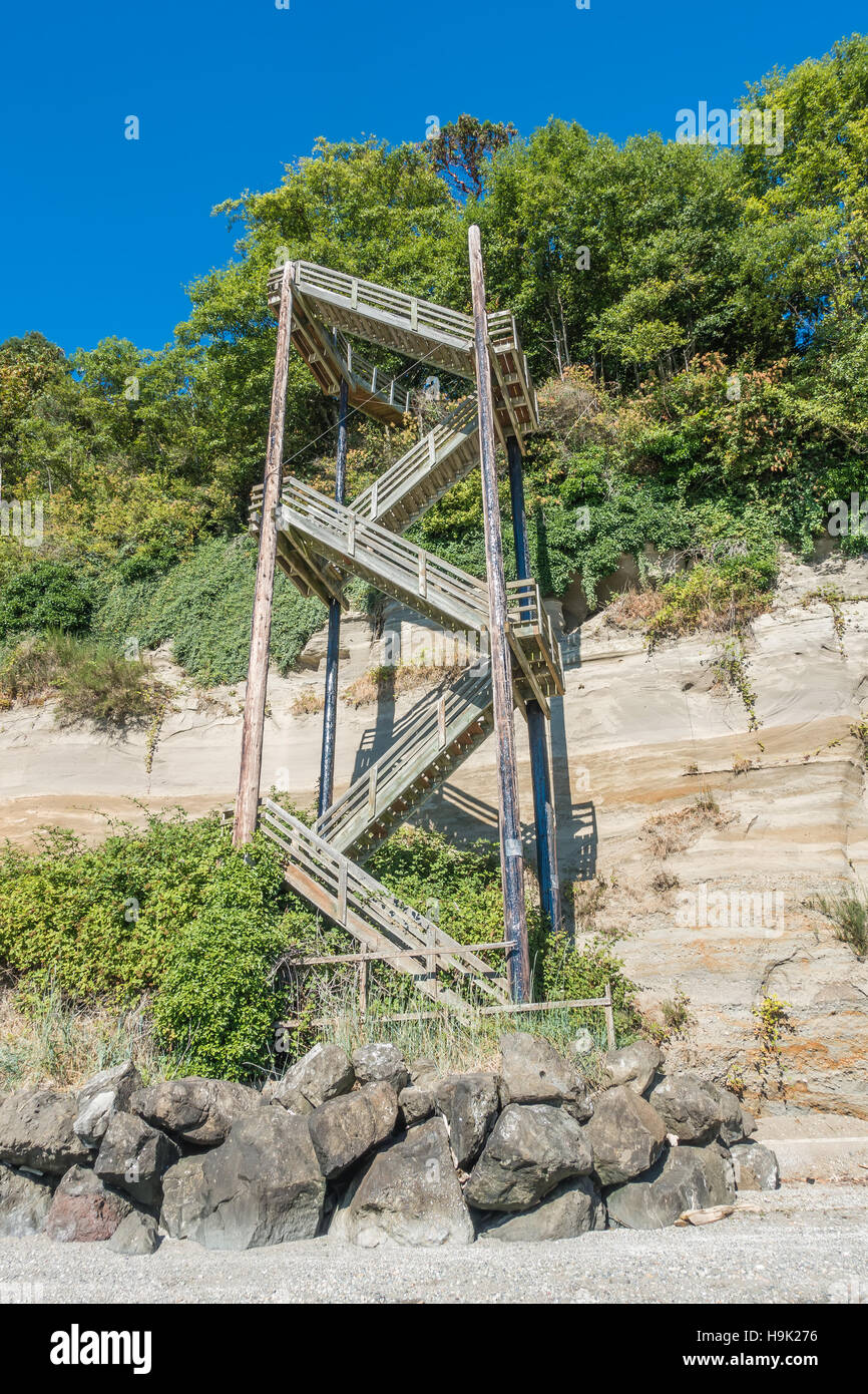 A vertical staircase rises straight up next to a hill at Saltwater ...