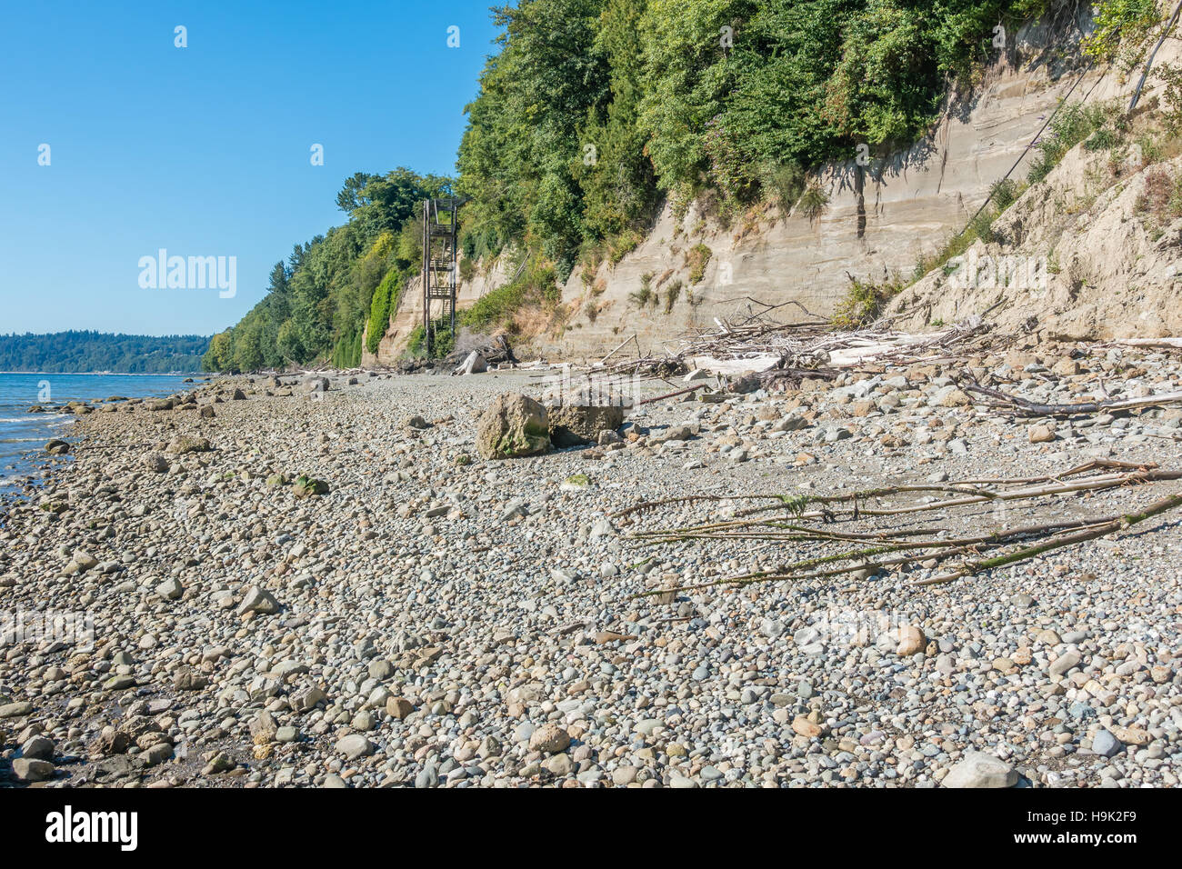 Vertical stairs rise up a steep hill on the shoreline of Saltwater ...