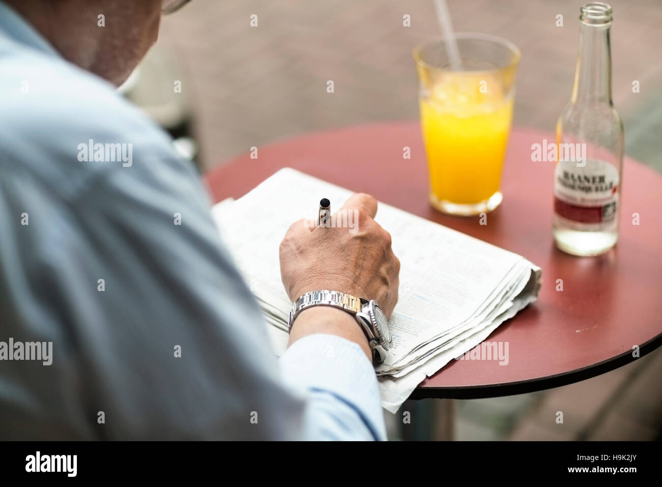 Person writing on newspaper hi-res stock photography and images - Alamy