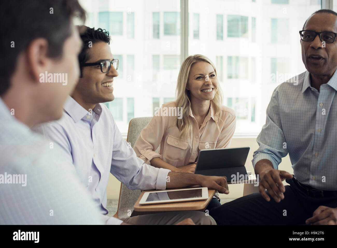 Business people in meeting having interesting discussion Stock Photo ...