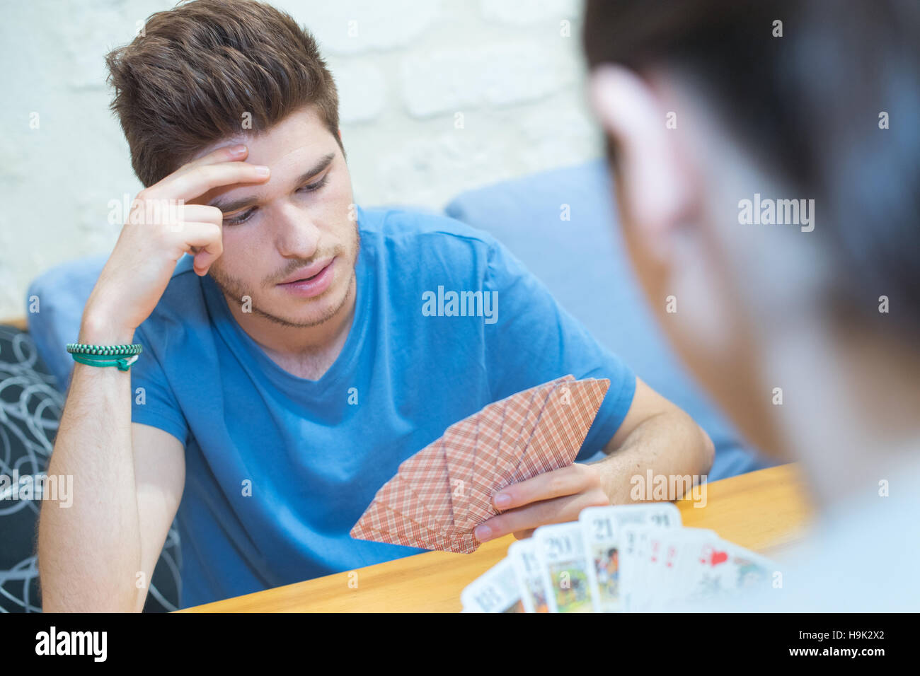 Two friends playing cards hi-res stock photography and images - Alamy