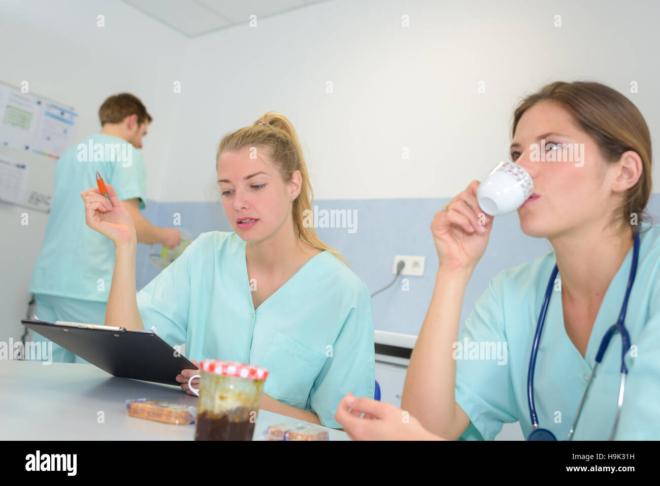 nurses talking on a break Stock Photo - Alamy