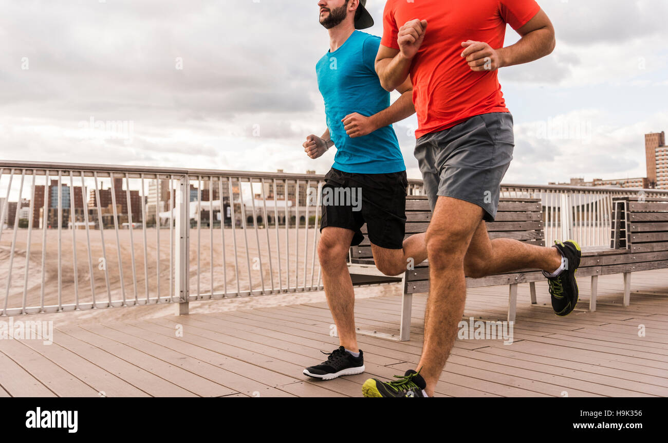USA, New York City, two men running on Coney Island Stock Photo - Alamy