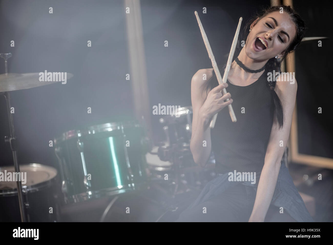 Female rock drummer at recording studio Stock Photo - Alamy
