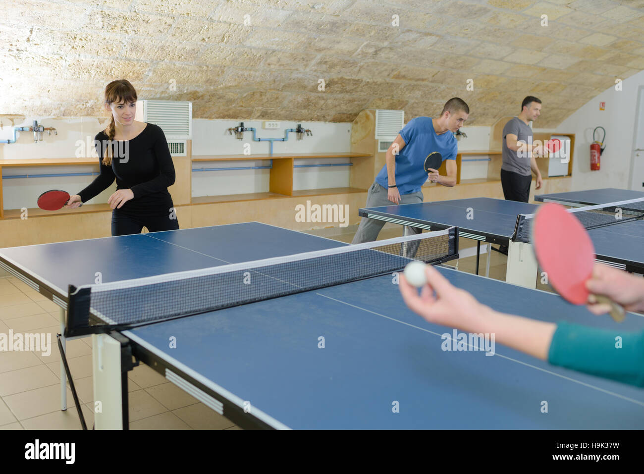 Woman playing ping pong hi-res stock photography and images - Alamy
