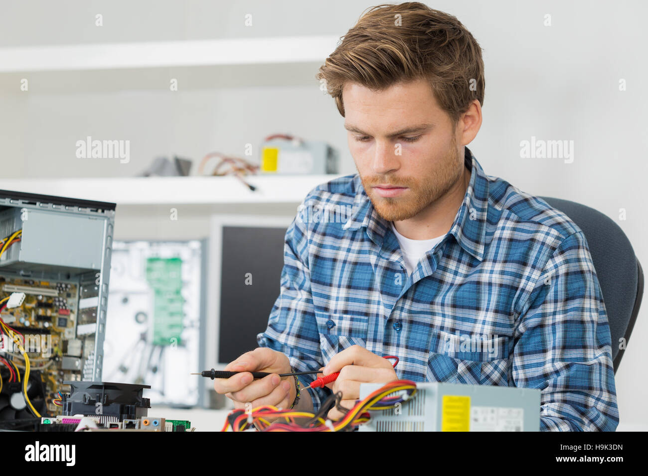 repairman fixing electronic devices Stock Photo - Alamy