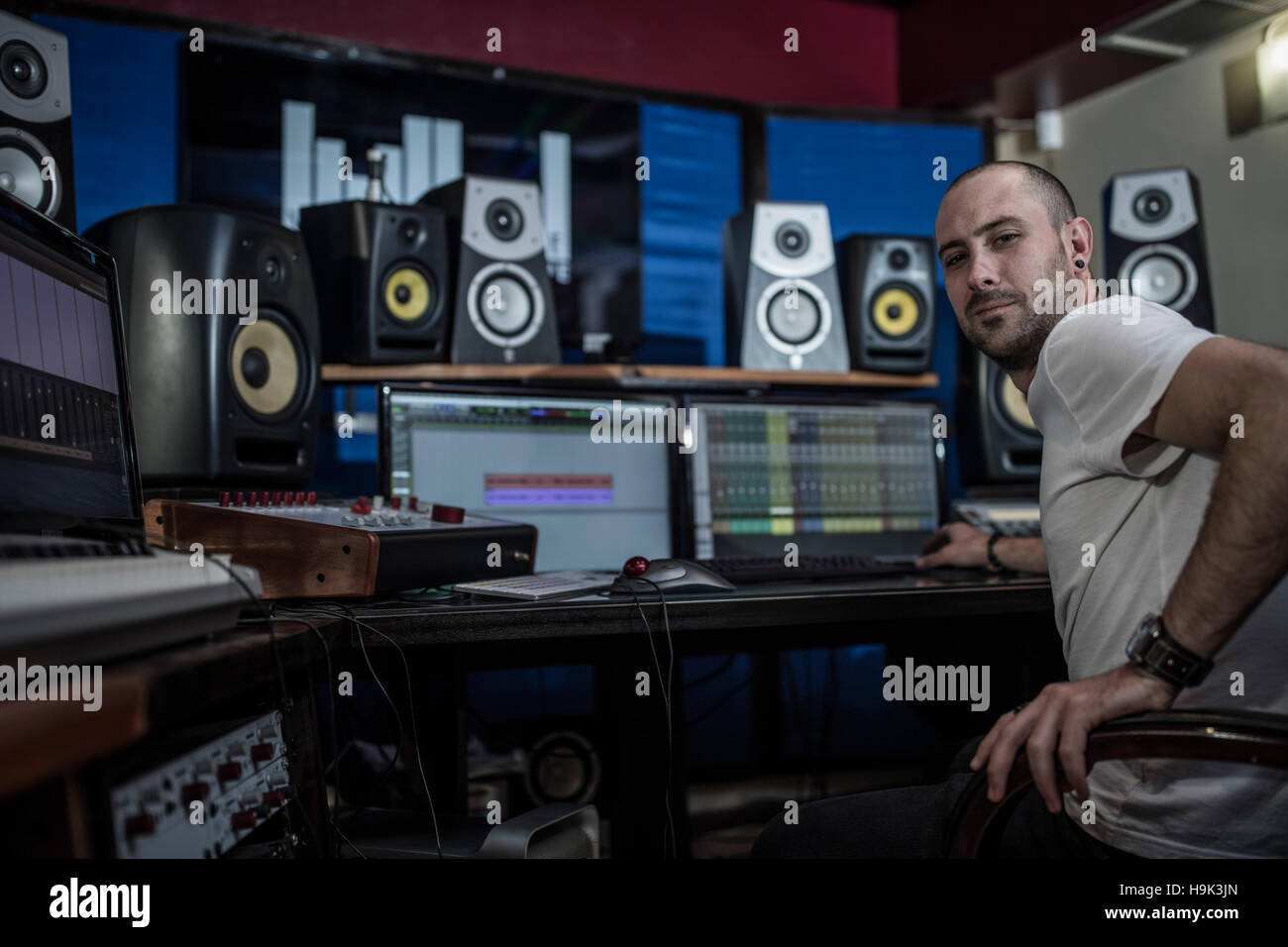 Confident audio engineer in recording studio Stock Photo - Alamy