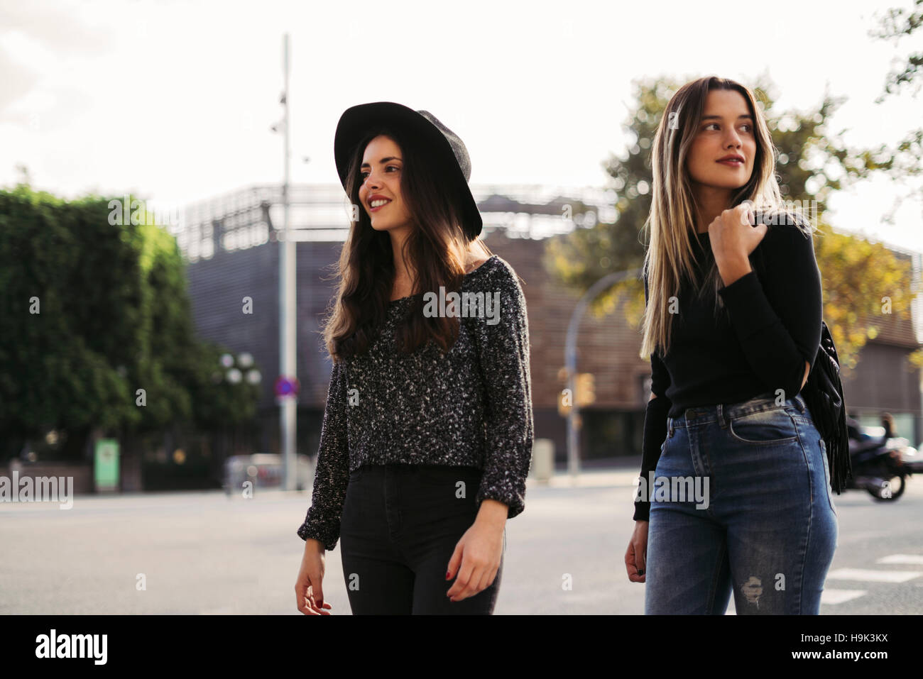 Two best friends walking in the city Stock Photo - Alamy