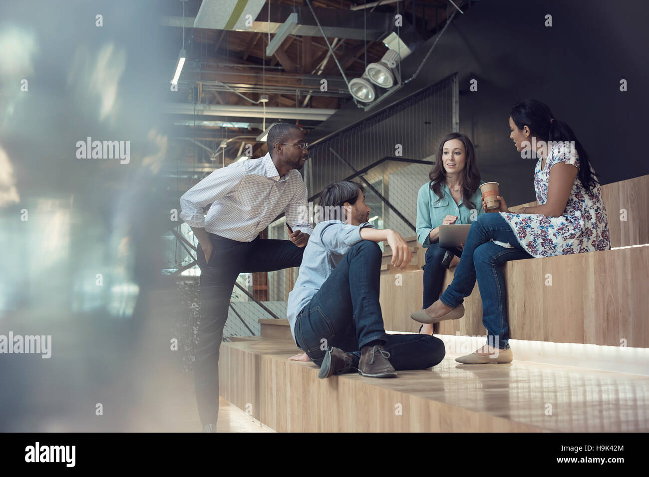 People sitting on stairs hi-res stock photography and images - Alamy