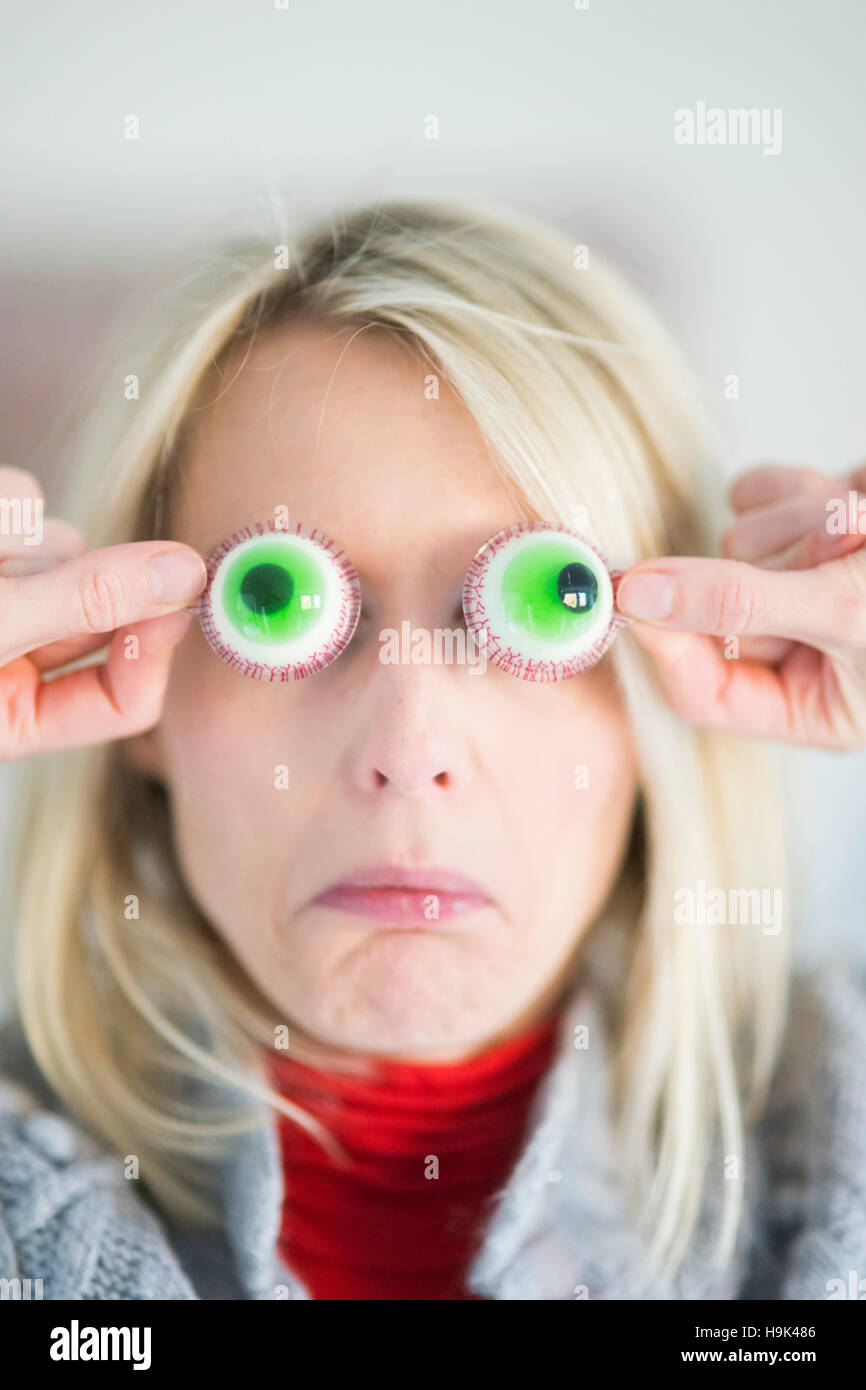 Woman with artificial sweets eyes Stock Photo - Alamy
