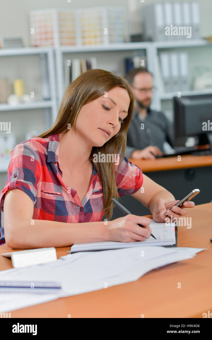 Stressed female office worker Stock Photo - Alamy