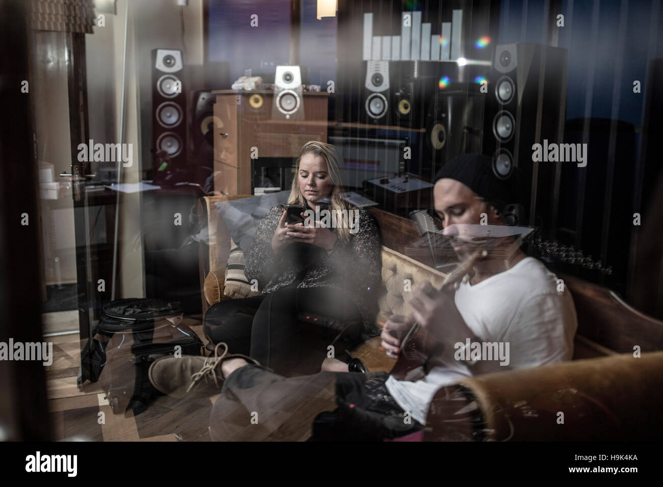 Two musicians on a break in recording studio Stock Photo - Alamy