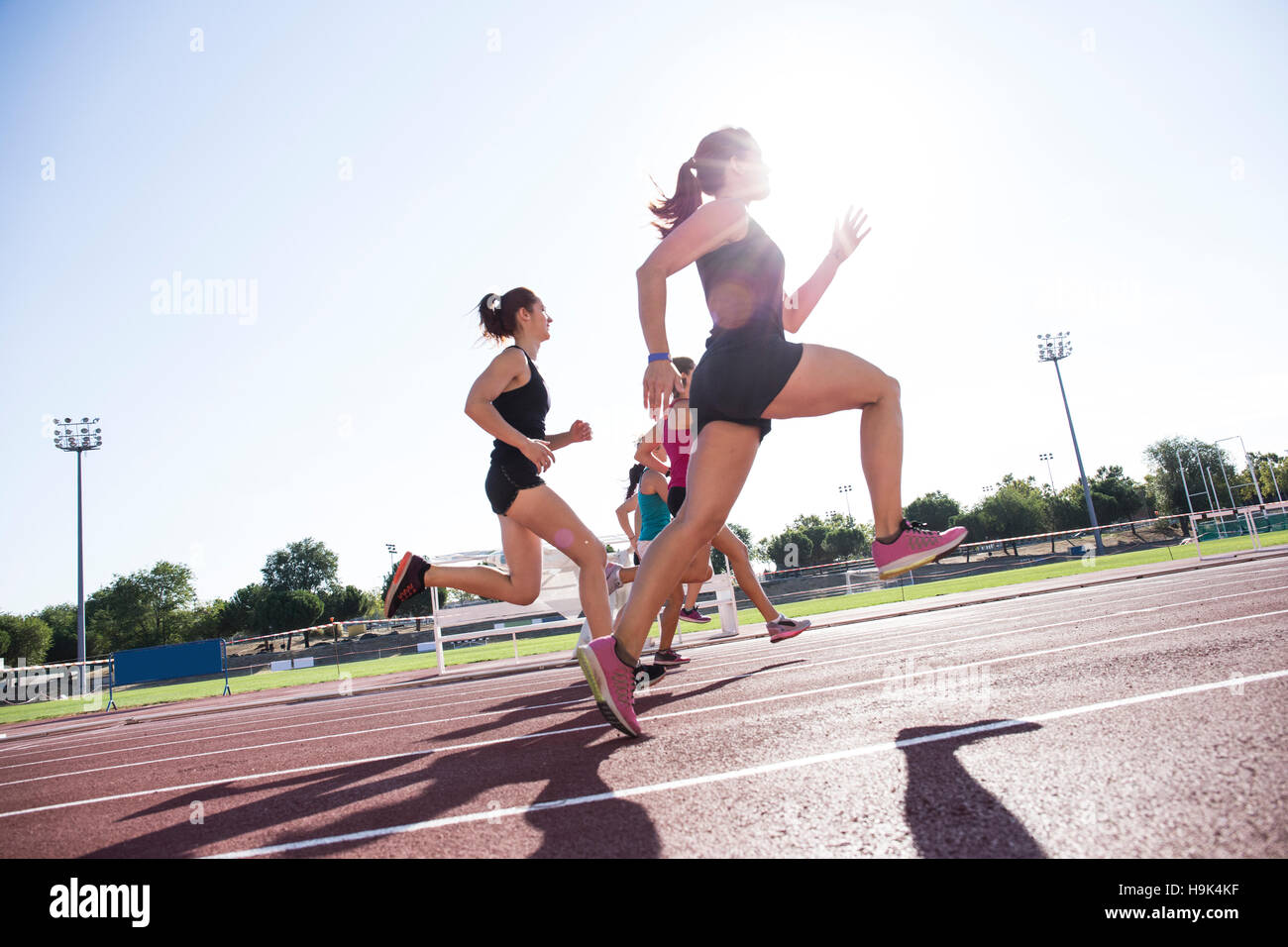 Female runners on tartan track Stock Photo - Alamy