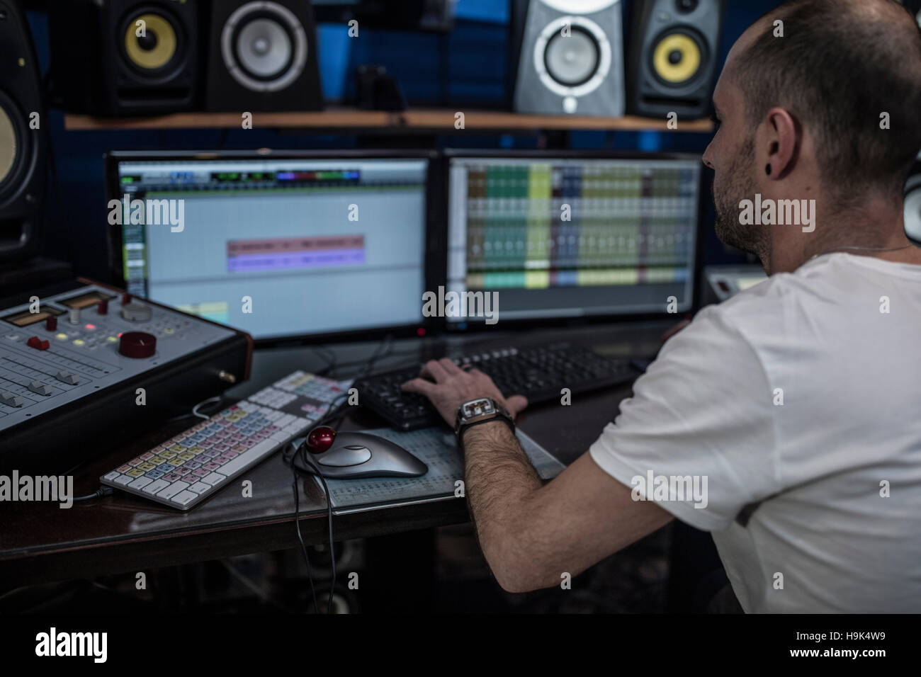 Audio engineer working in recording studio Stock Photo - Alamy