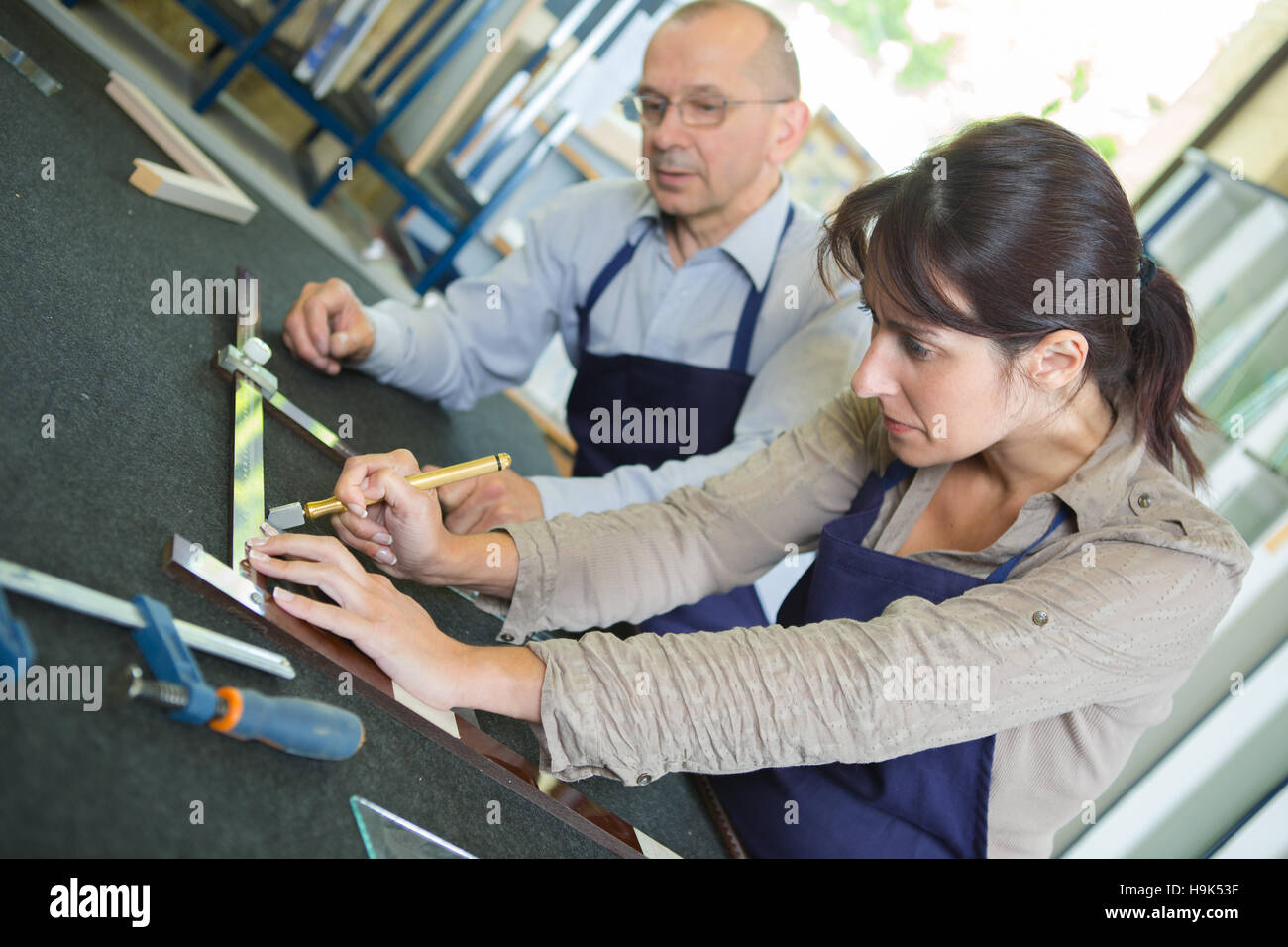 carpenters making frames in a workshop Stock Photo - Alamy