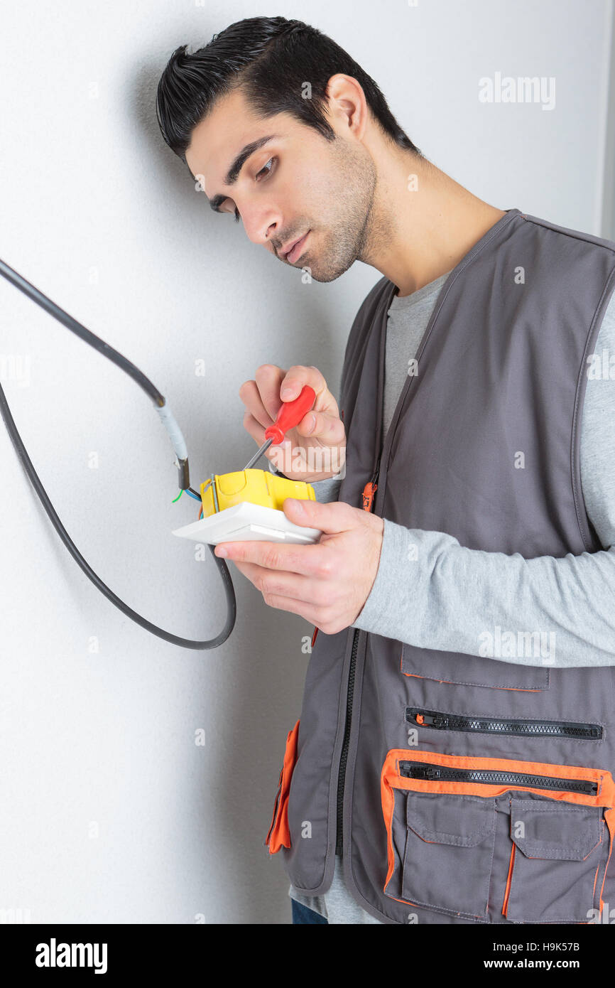 Electrician wiring switch Stock Photo - Alamy