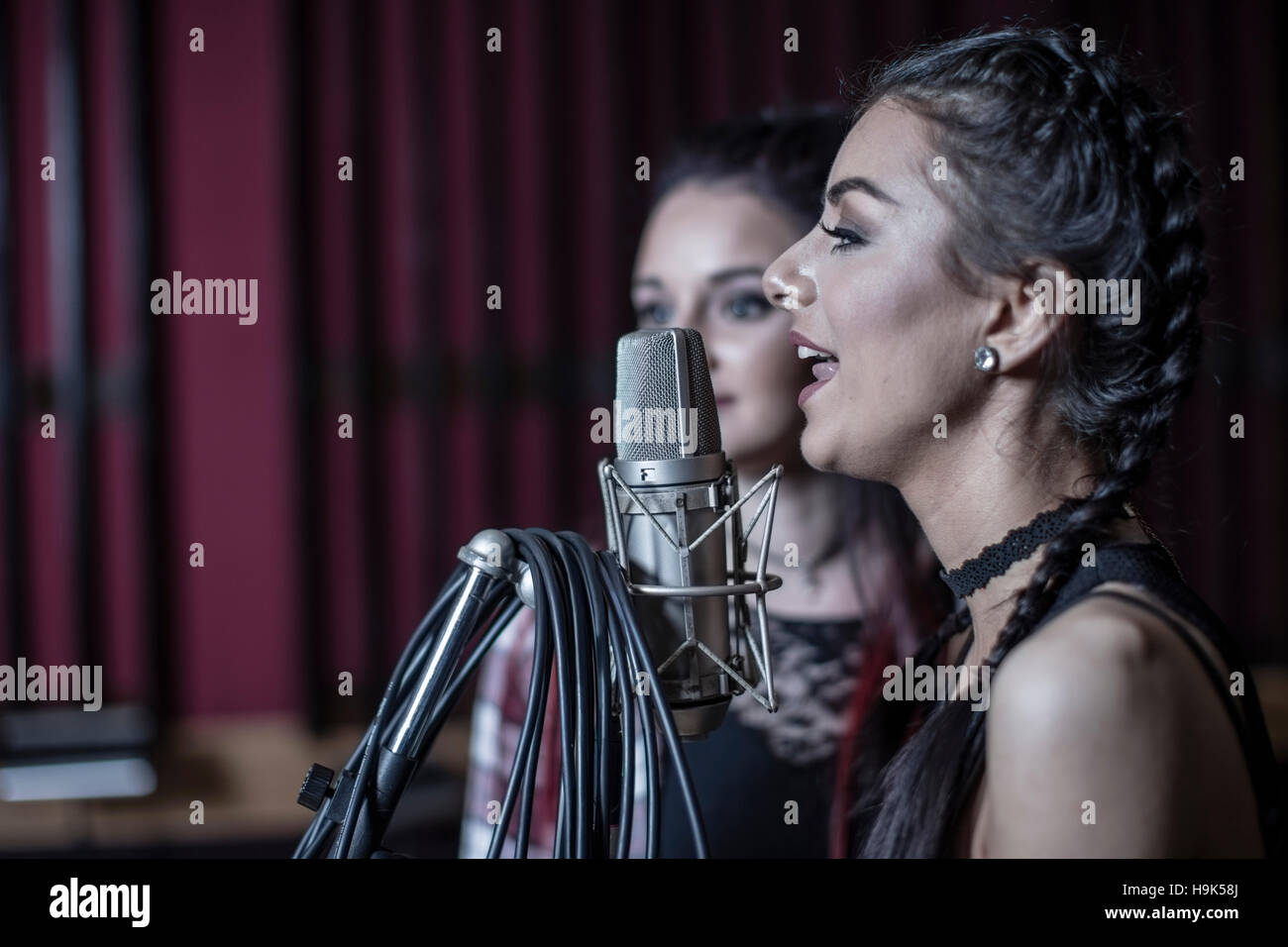 Two singers at recording studio Stock Photo - Alamy
