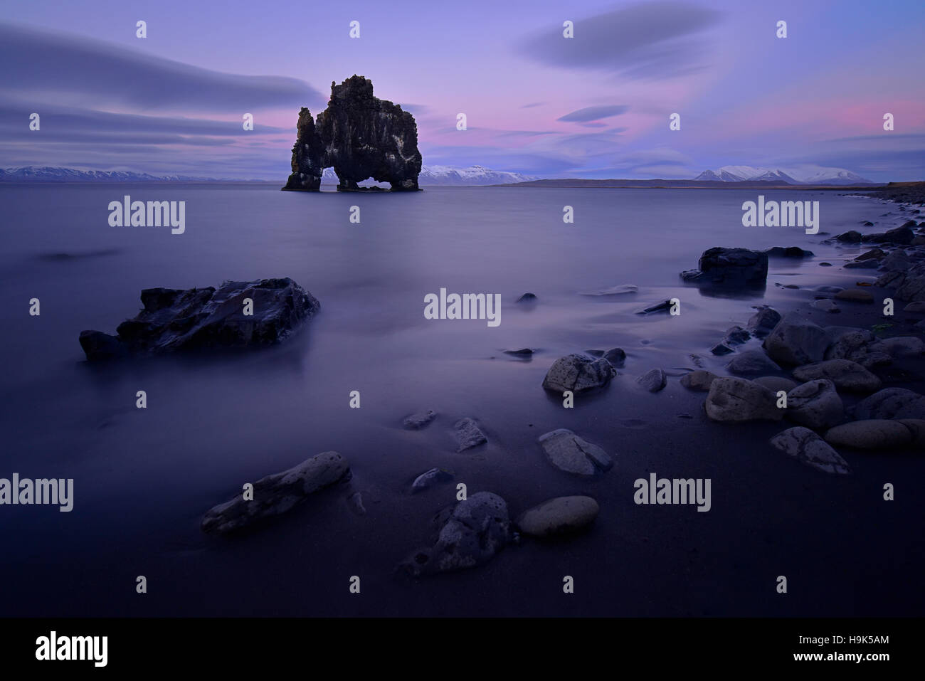 Iceland, ocean with rock formation in Northern Iceland at twilight ...