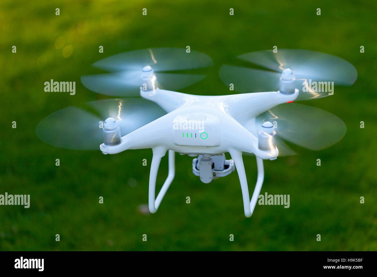 Flying drone with camera Stock Photo - Alamy