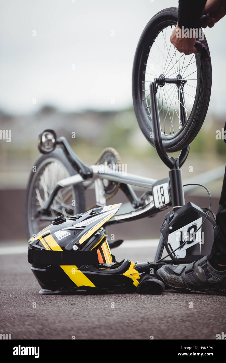 Cyclist repairing a BMX bike Stock Photo - Alamy