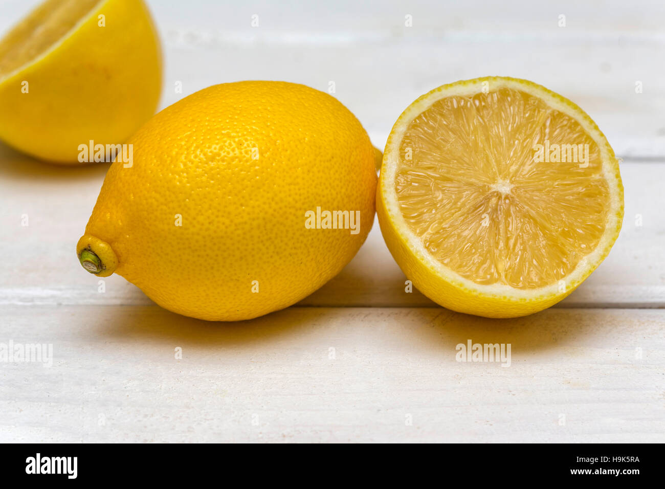 Group of fresh lemon on an old vintage wooden table Stock Photo - Alamy