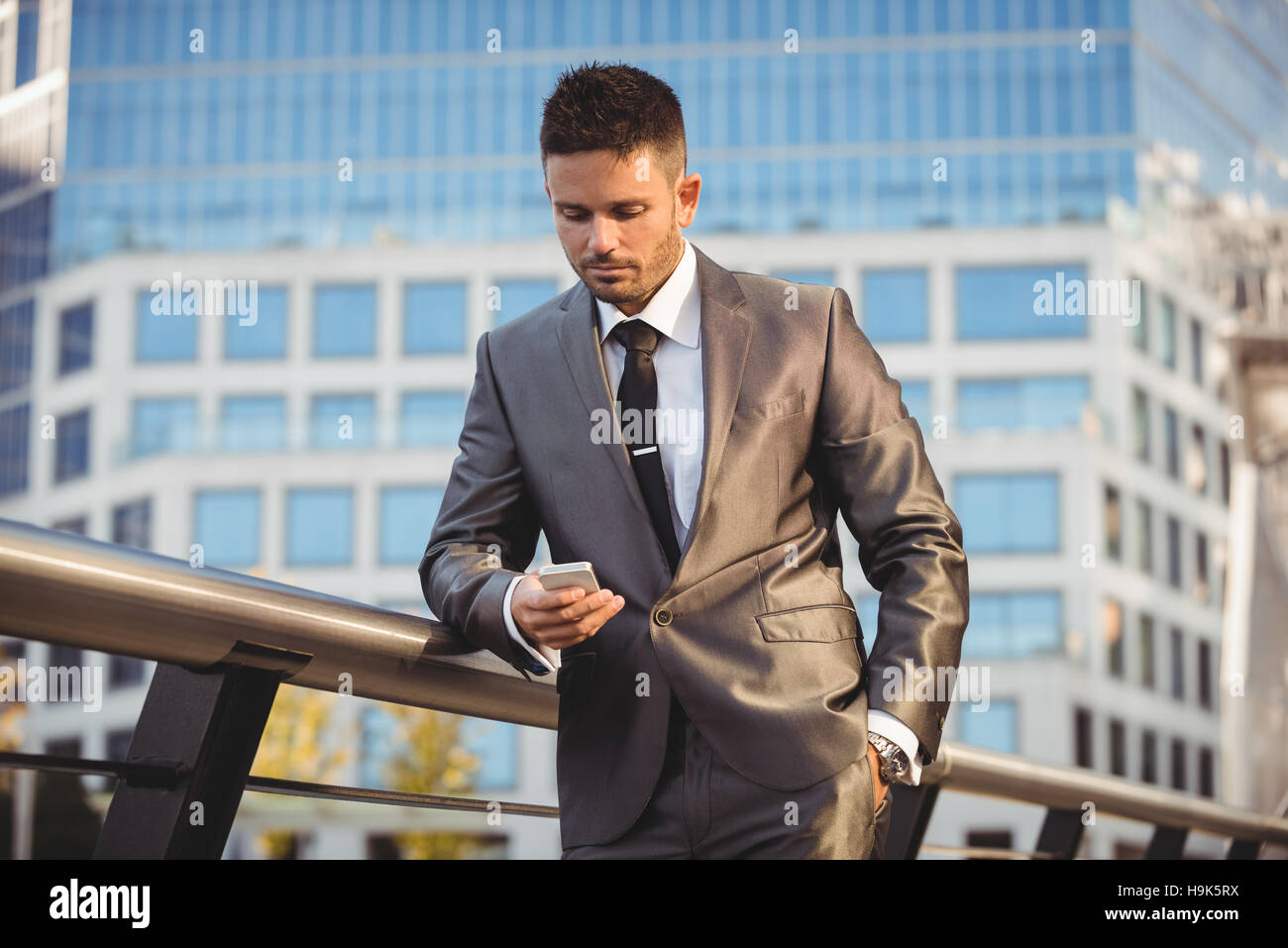Businessman using mobile phone Stock Photo - Alamy