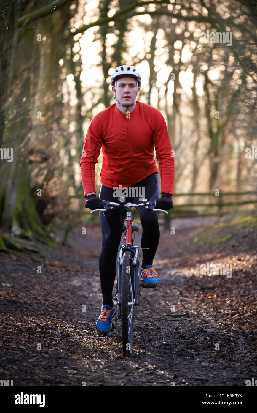 Man Riding Mountain Bike Through Woodlands Stock Photo - Alamy