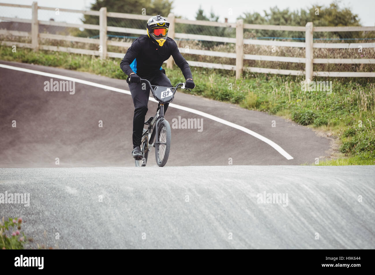 Cyclist riding BMX bike Stock Photo - Alamy