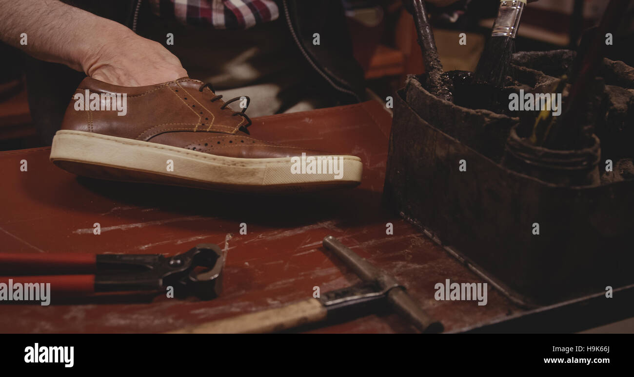 Cobbler holding shoe no sole hi-res stock photography and images - Alamy