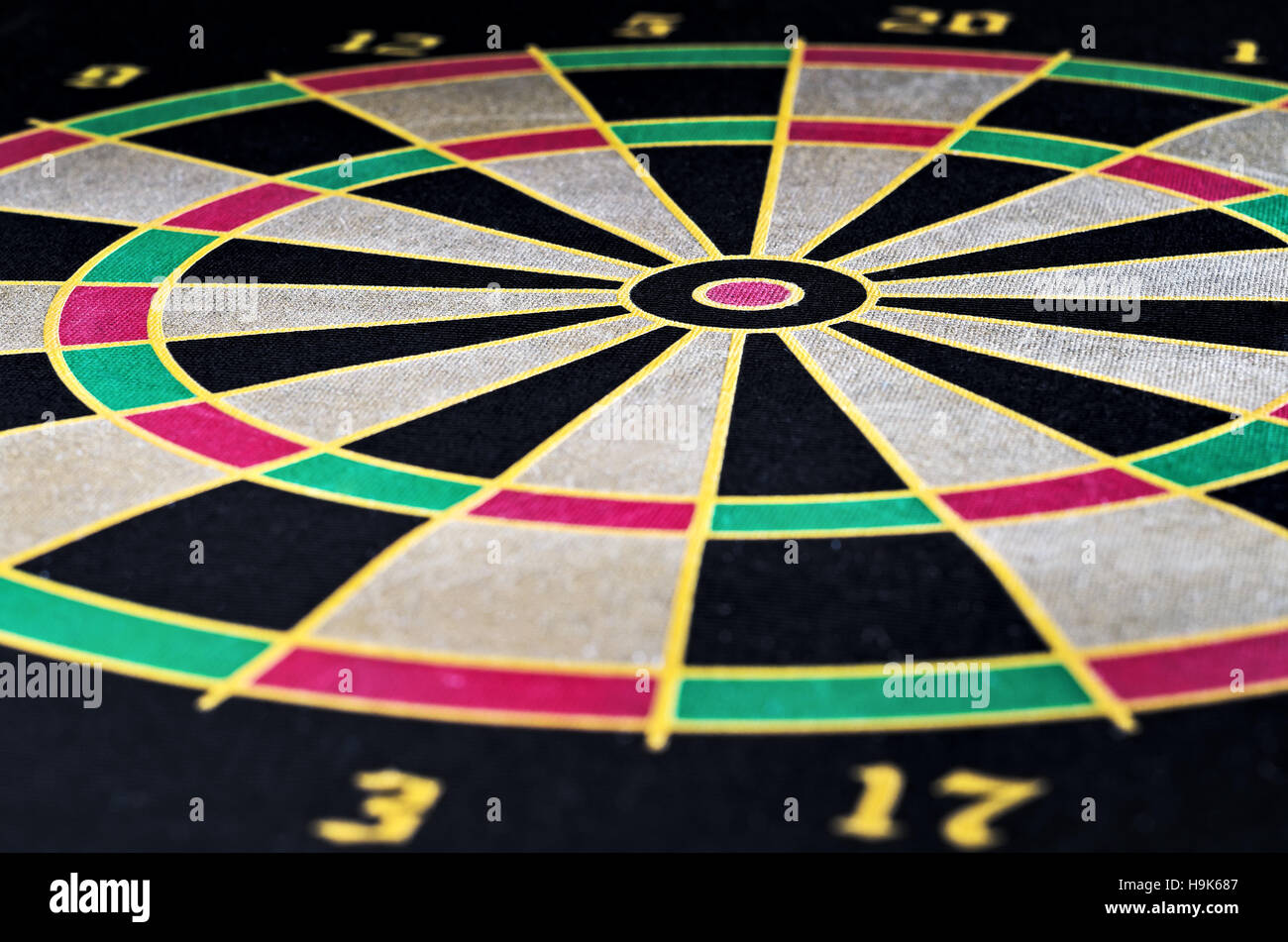 Darts hit the target, darts closeup as a background, miss the shot, an ...