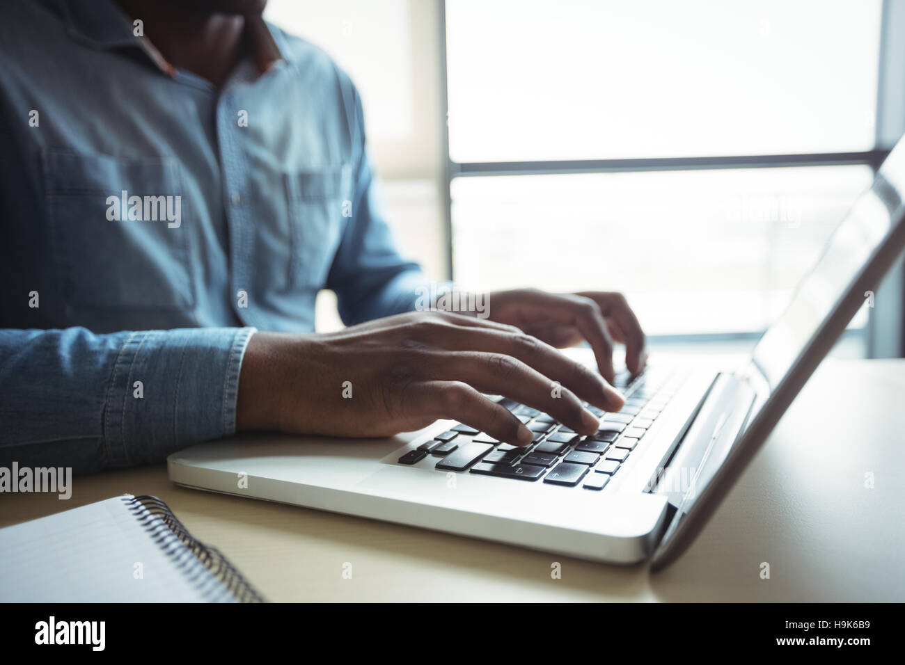Business executive using laptop Stock Photo - Alamy