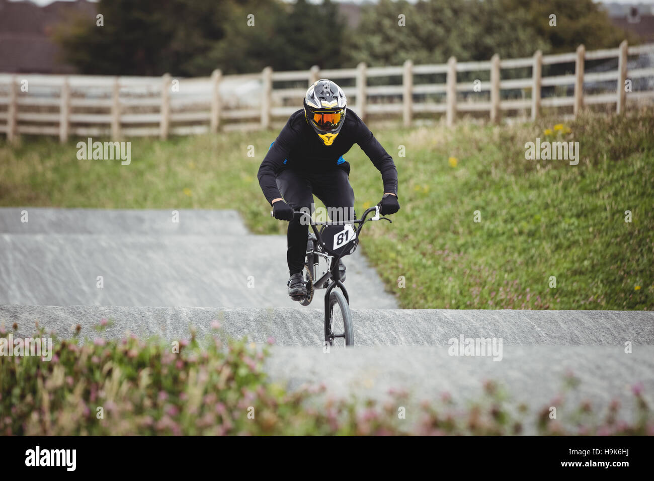 Cyclist riding BMX bike Stock Photo - Alamy