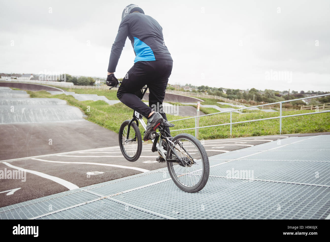 Cyclist riding BMX bike Stock Photo - Alamy