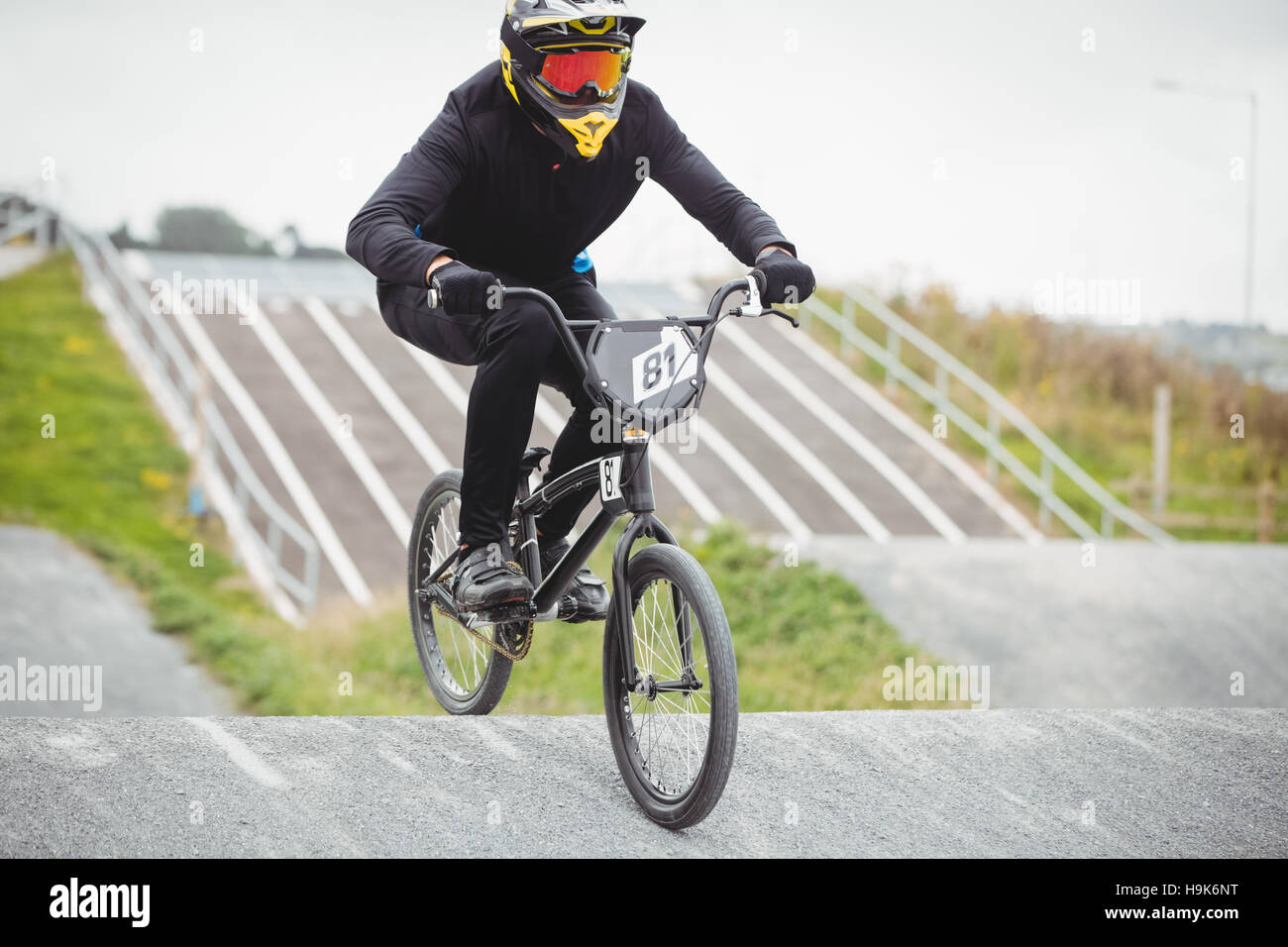 Cyclist riding BMX bike Stock Photo - Alamy