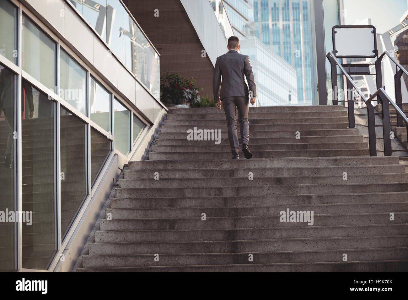 Man walking up stairs hi-res stock photography and images - Alamy